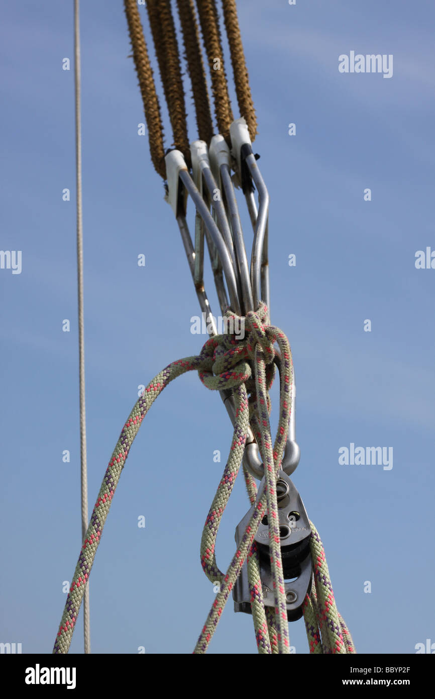 Trapeze ropes with pulley block from a sail boat on a beach Stock Photo ...