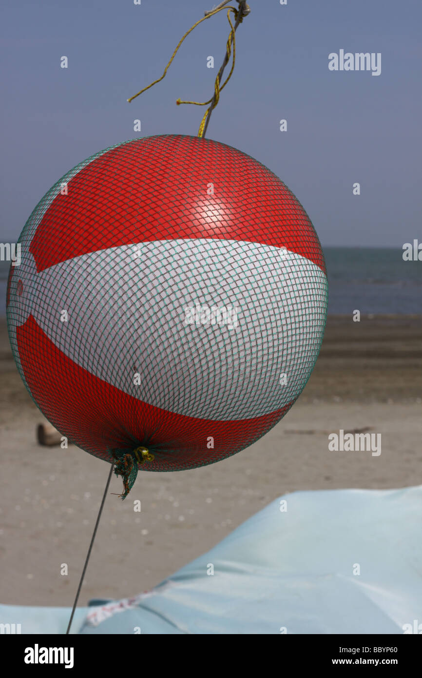 floating ball from a small sail boat on a beach Stock Photo - Alamy