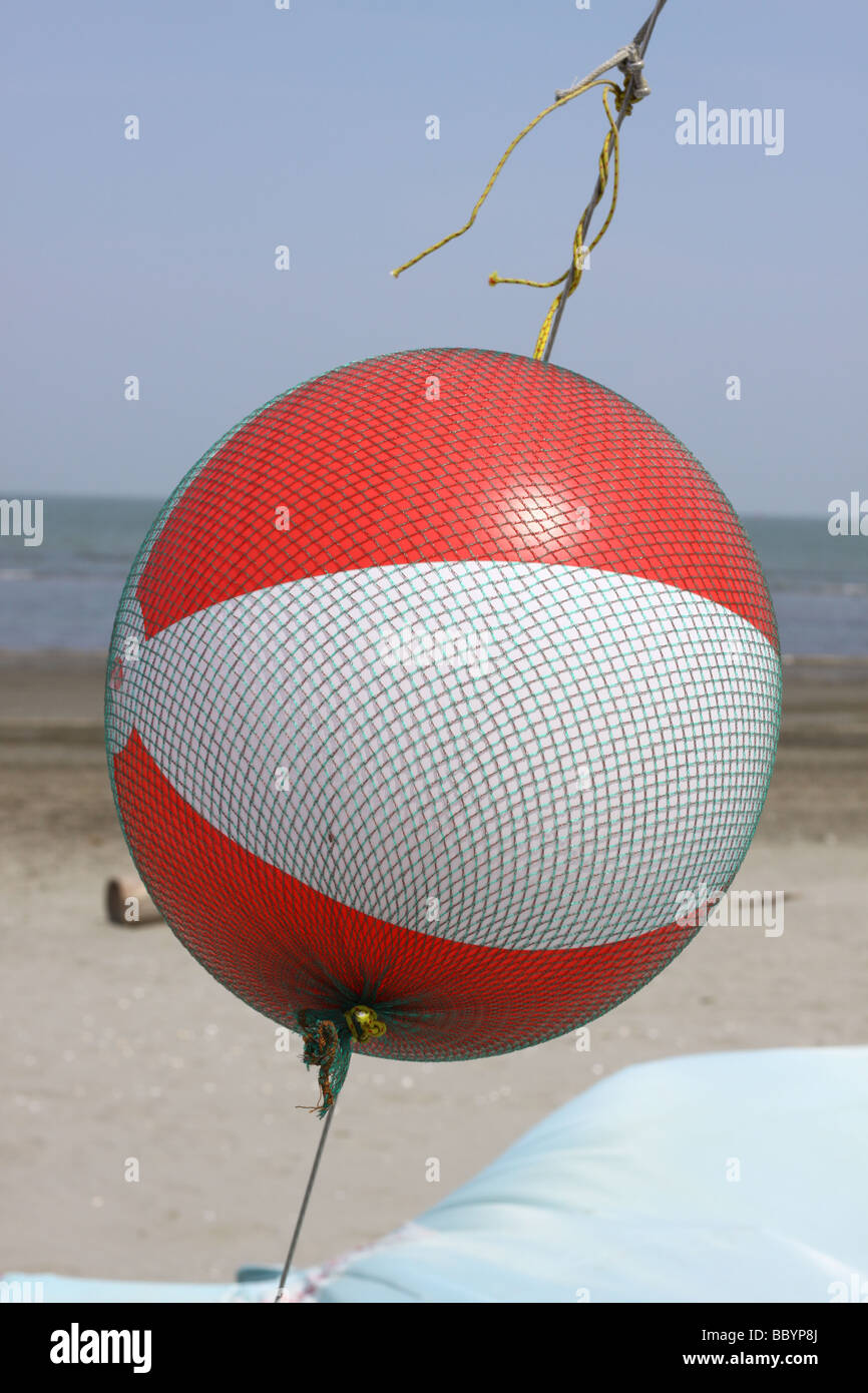 floating ball from a small sail boat on a beach Stock Photo - Alamy