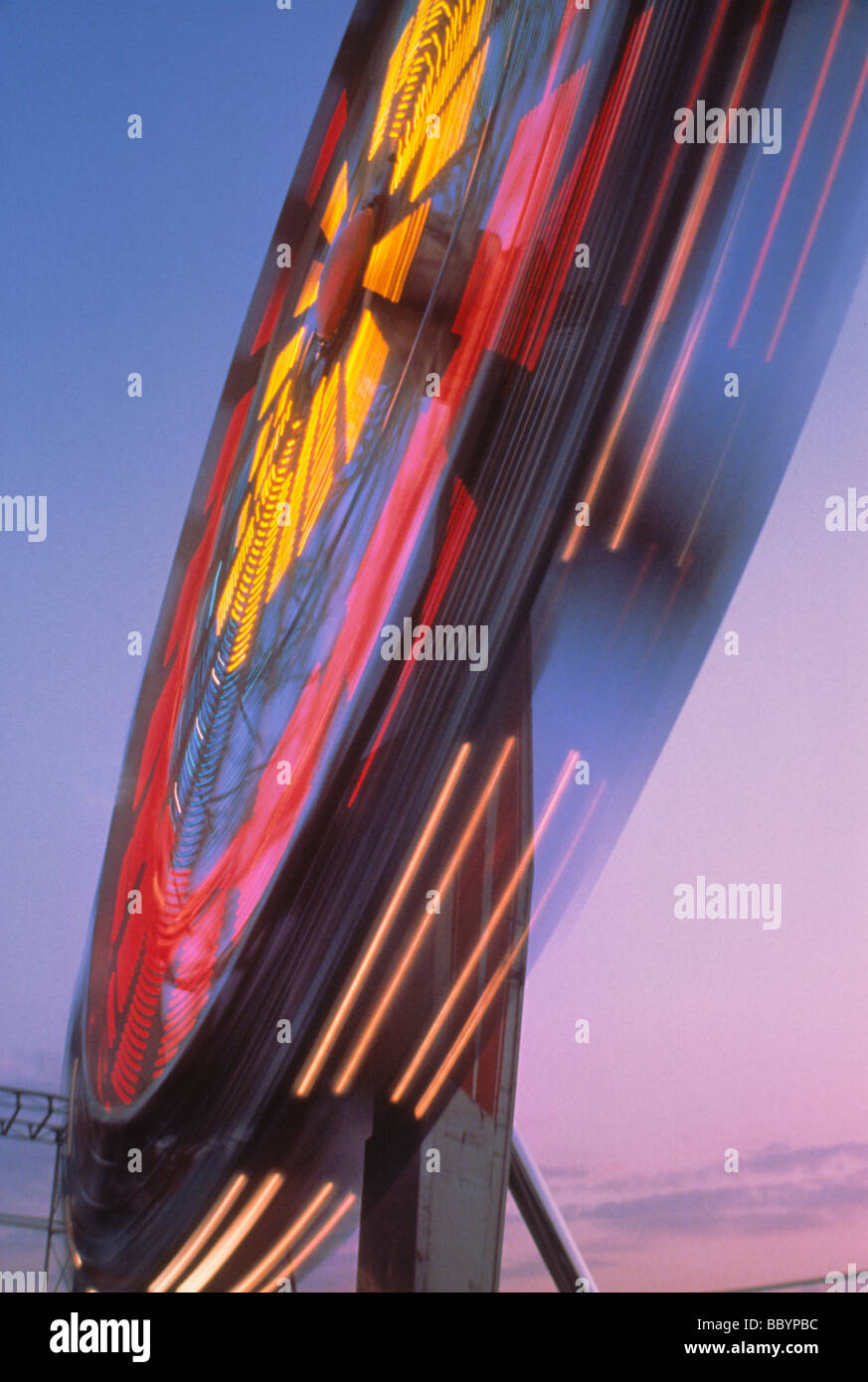 Carnival ride spin blur speed fun excite thrill danger color light sky ...