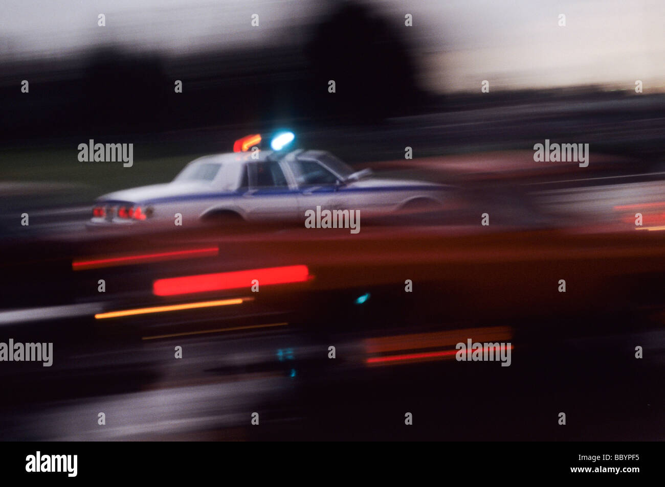 Police car speed emergency response light siren fast blur rush aid help ...