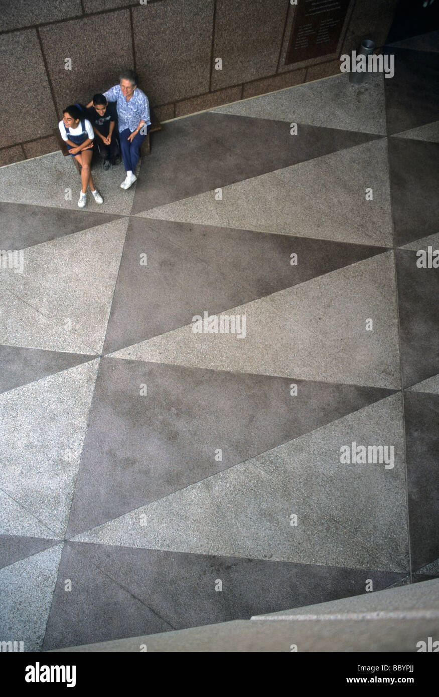 Triangle math geometry floor terrazo tile pattern shape people sit ...