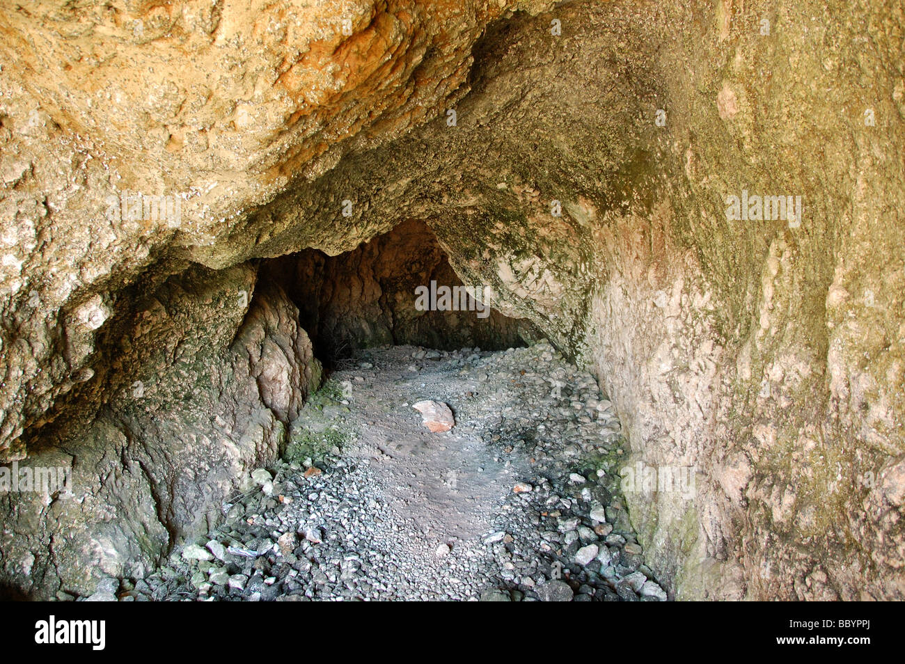 Narrow natural cave interior Stock Photo - Alamy