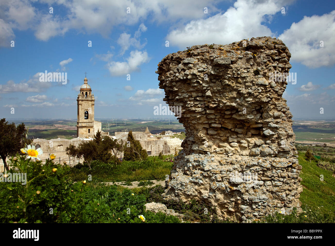 Santa Maria Church and ruins of the castle in the white village of ...