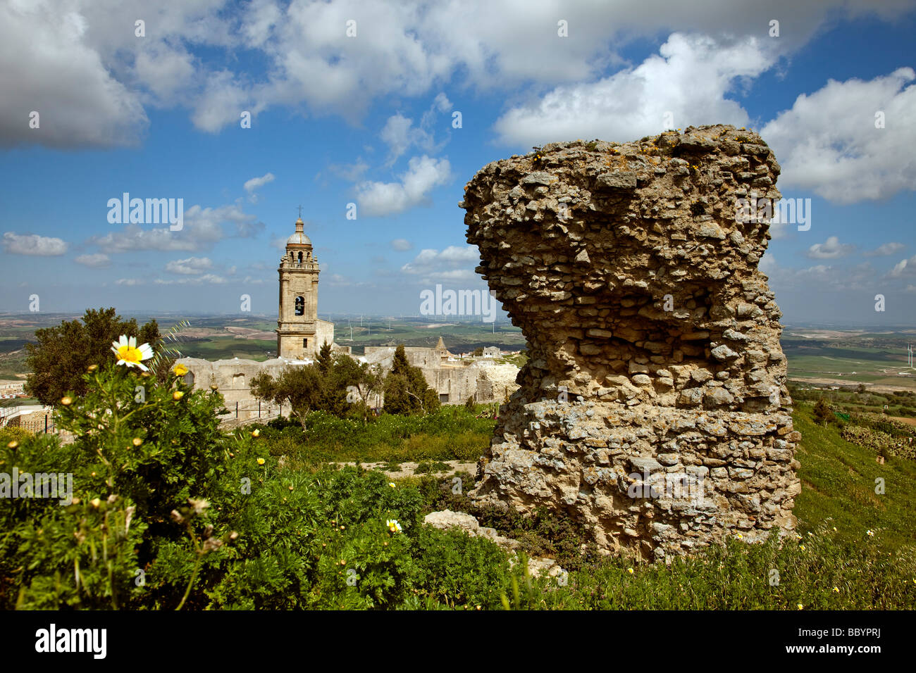 Santa Maria Church and ruins of the castle in the white village of ...