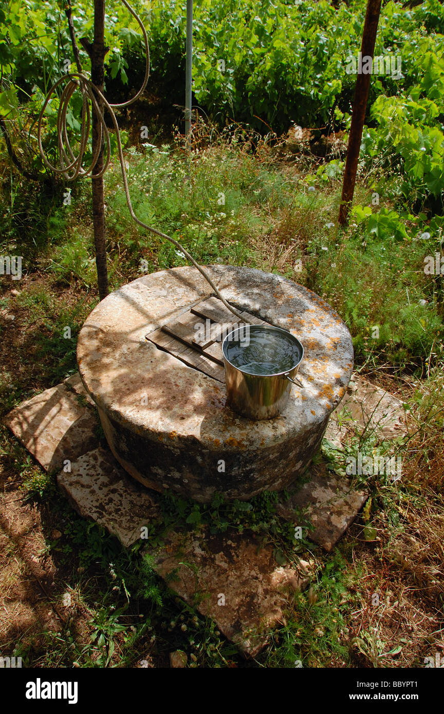 Old Stone Well With Bucket Stock Photos & Old Stone Well With Bucket ...