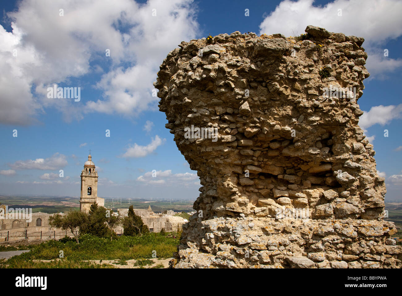 Santa Maria Church and ruins of the castle in the white village of ...