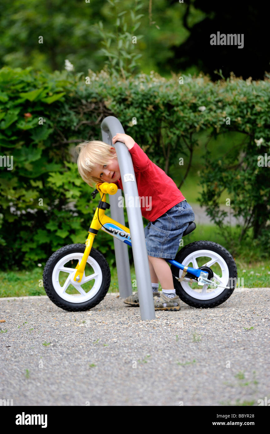 Little boy riding a bounce bicycle Stock Photo - Alamy