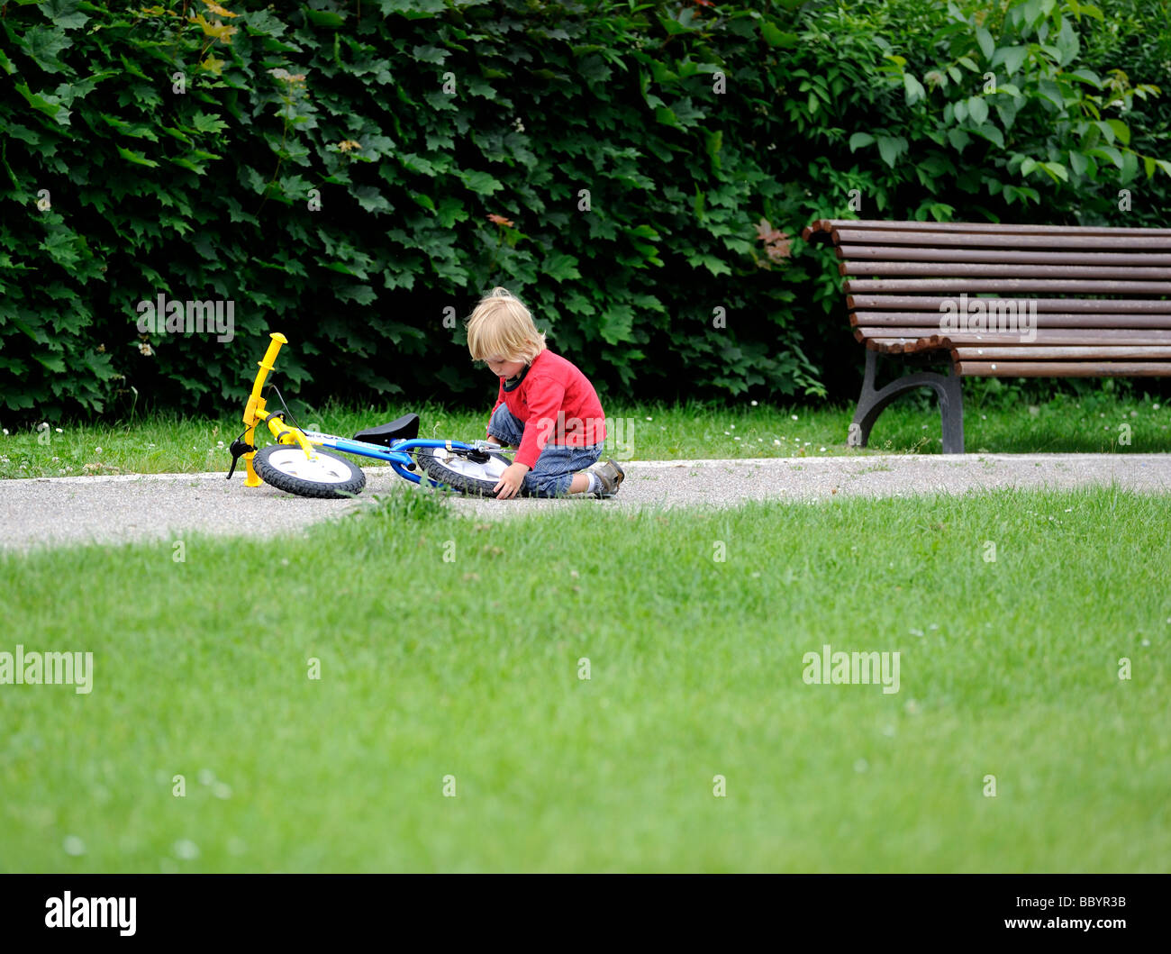 Little boy riding a bounce bicycle Stock Photo - Alamy