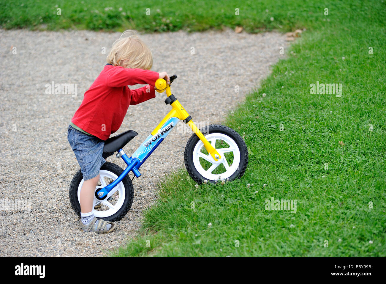 Little boy riding a bounce bicycle Stock Photo - Alamy