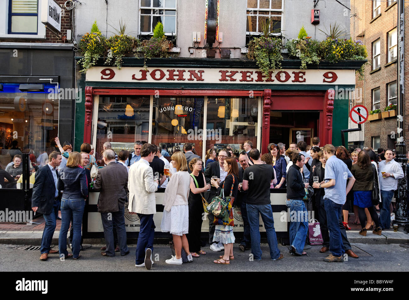 Young people drinking outside John Kehoe pub on Duke St in Dublin ...