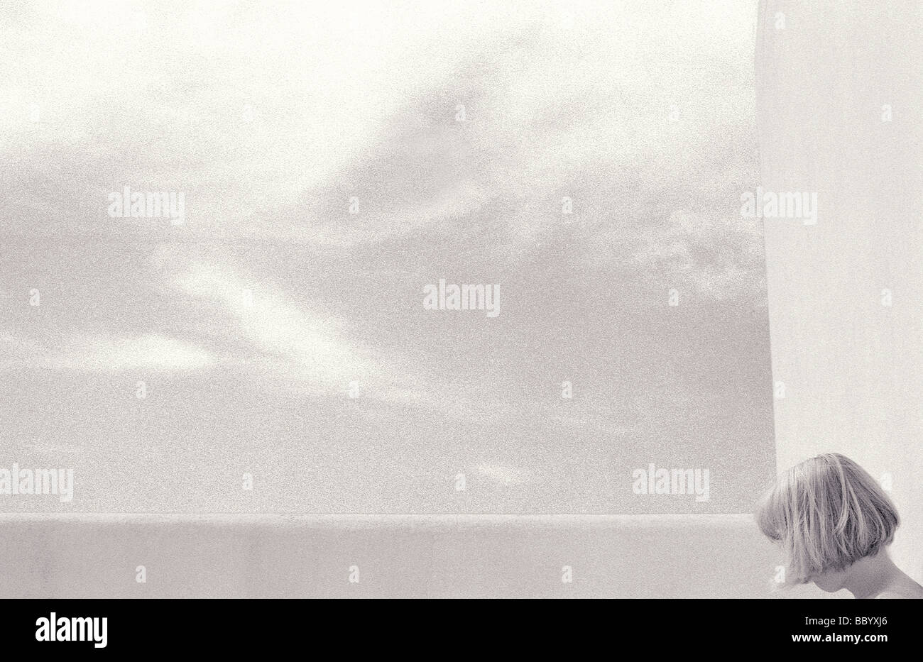 Young girl beside window Stock Photo - Alamy