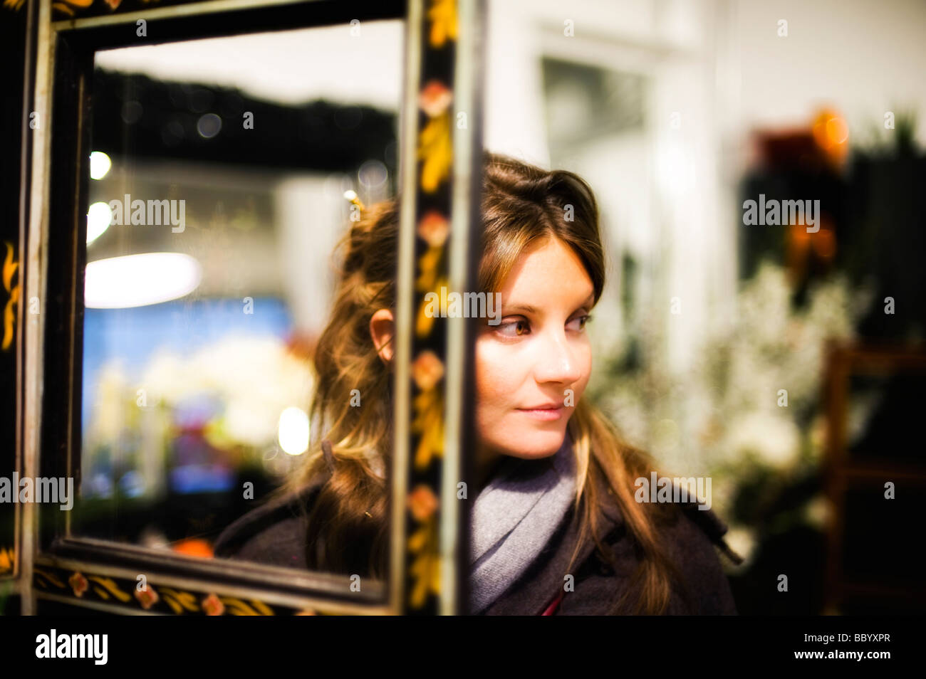 Young woman behind window Stock Photo - Alamy