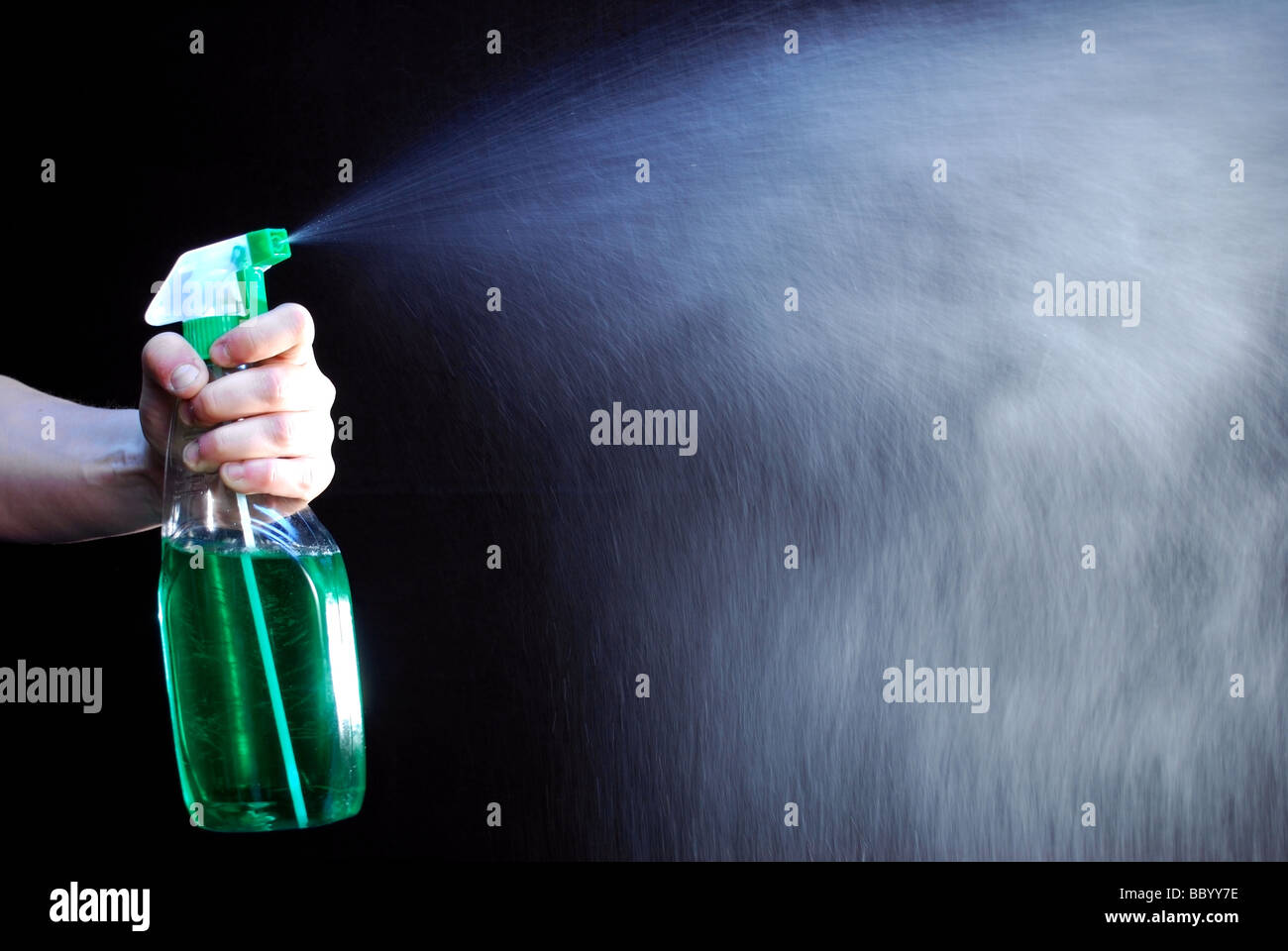 Man using spray Stock Photo - Alamy