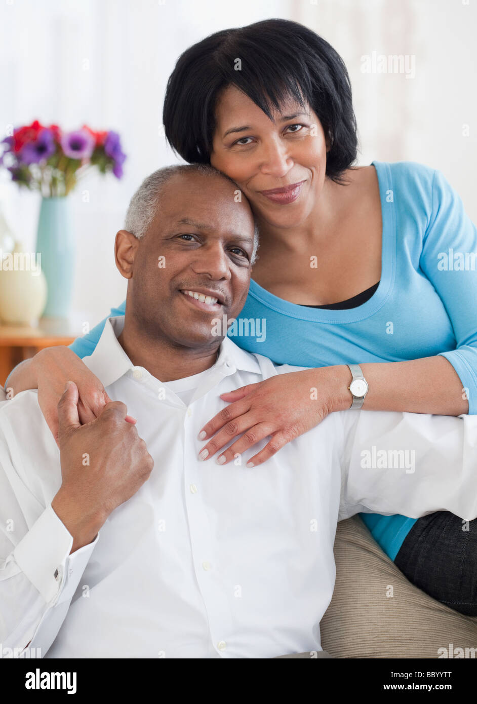 African couple hugging Stock Photo - Alamy