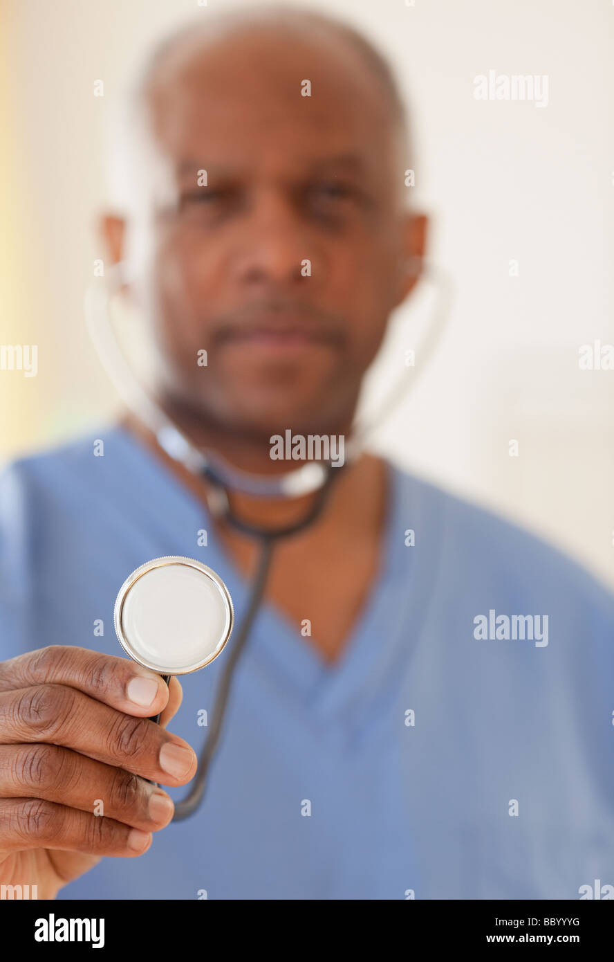 African doctor holding stethoscope Stock Photo - Alamy