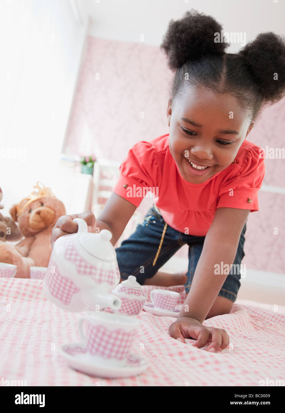 African girl having tea party Stock Photo - Alamy