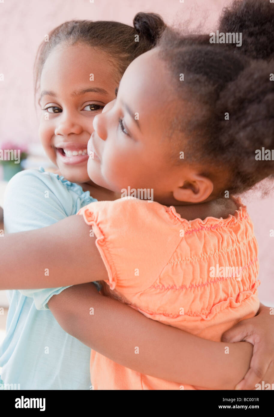 African girls hugging Stock Photo - Alamy