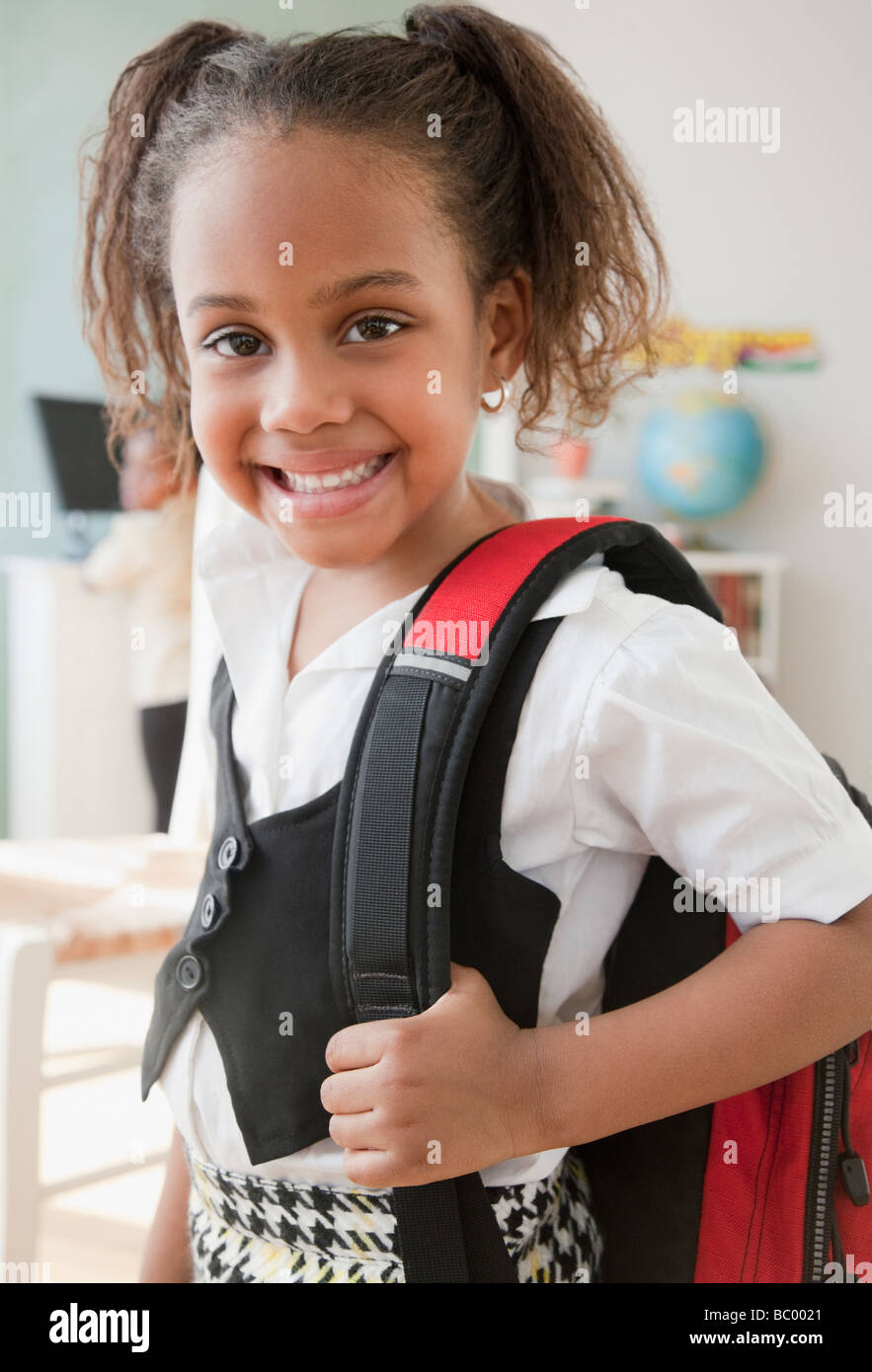 African girl carrying backpack Stock Photo - Alamy