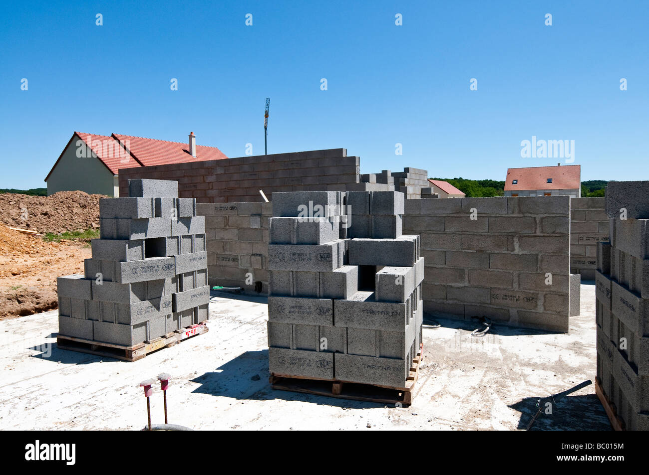 Stacks of breeze block building materials on new housing estate - Indre ...