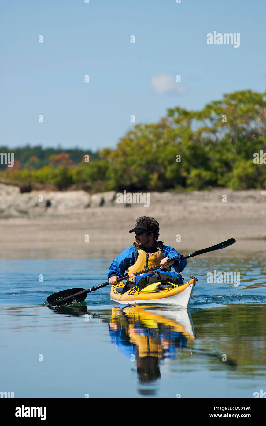 A man sea kayaking on the Maine coast Stock Photo - Alamy