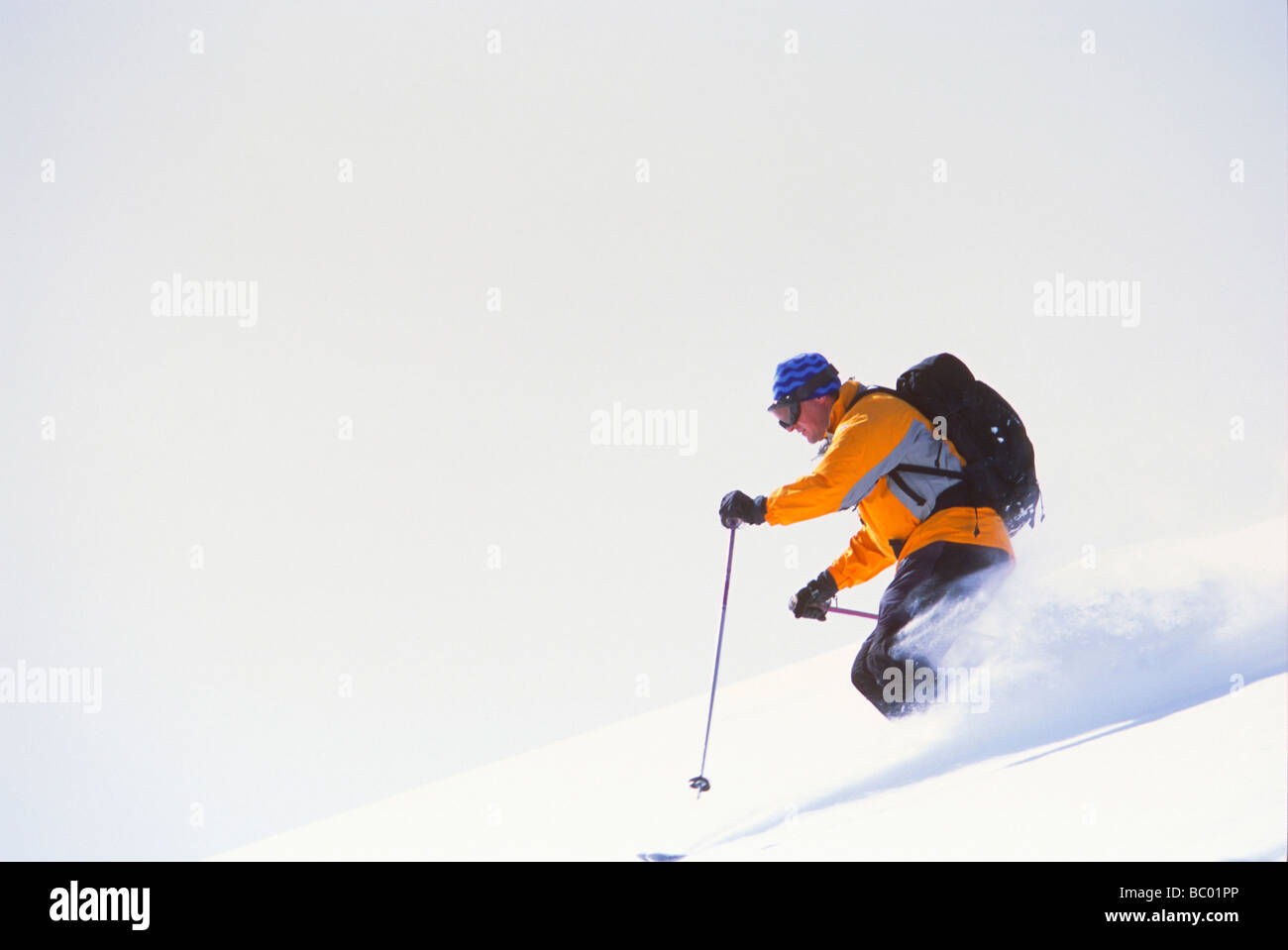 Solo male skiing in powder Stock Photo - Alamy