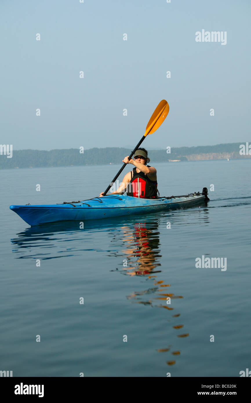 Female kayaker on a lake Stock Photo - Alamy