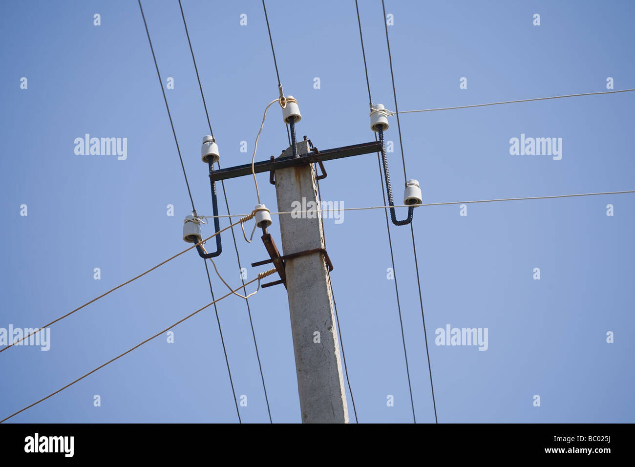 pattern of wires on telegraph post on blue sky background Stock Photo ...