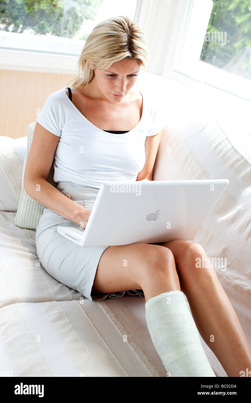 Woman using laptop at home Stock Photo - Alamy