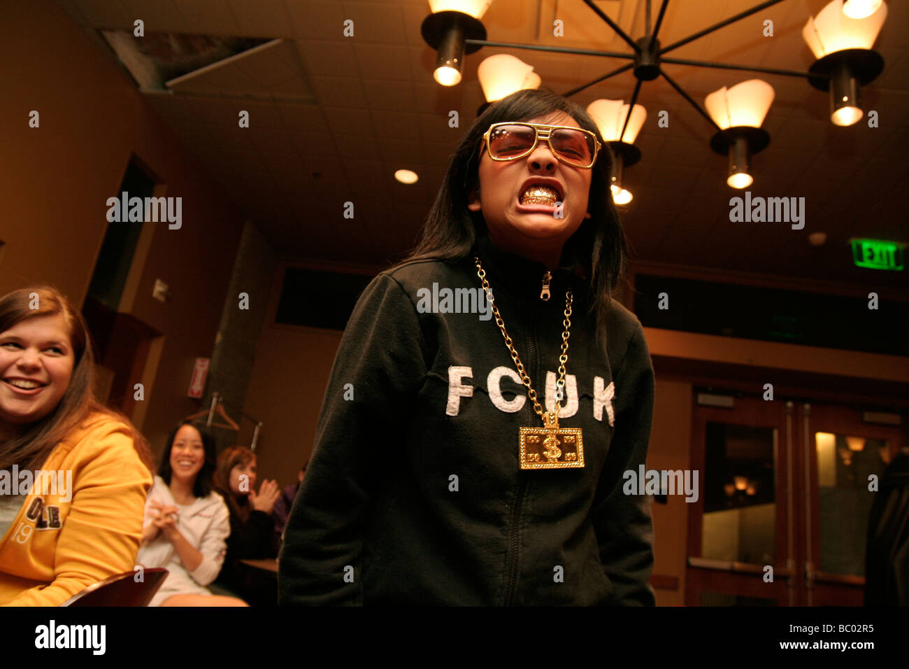 A young woman competes as a rapper in a costume contest in Seattle ...