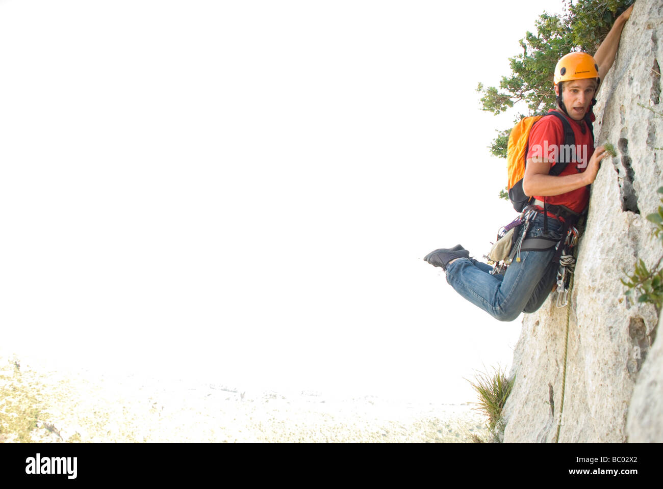 Climber rappelling at a rock wall hi-res stock photography and images ...