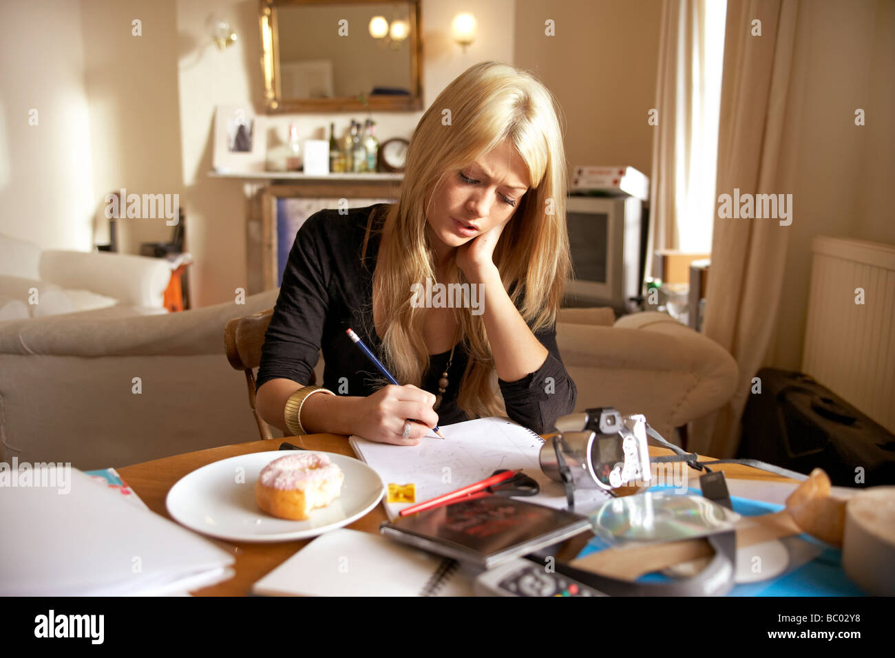 Teenage girl doing her homework Stock Photo - Alamy