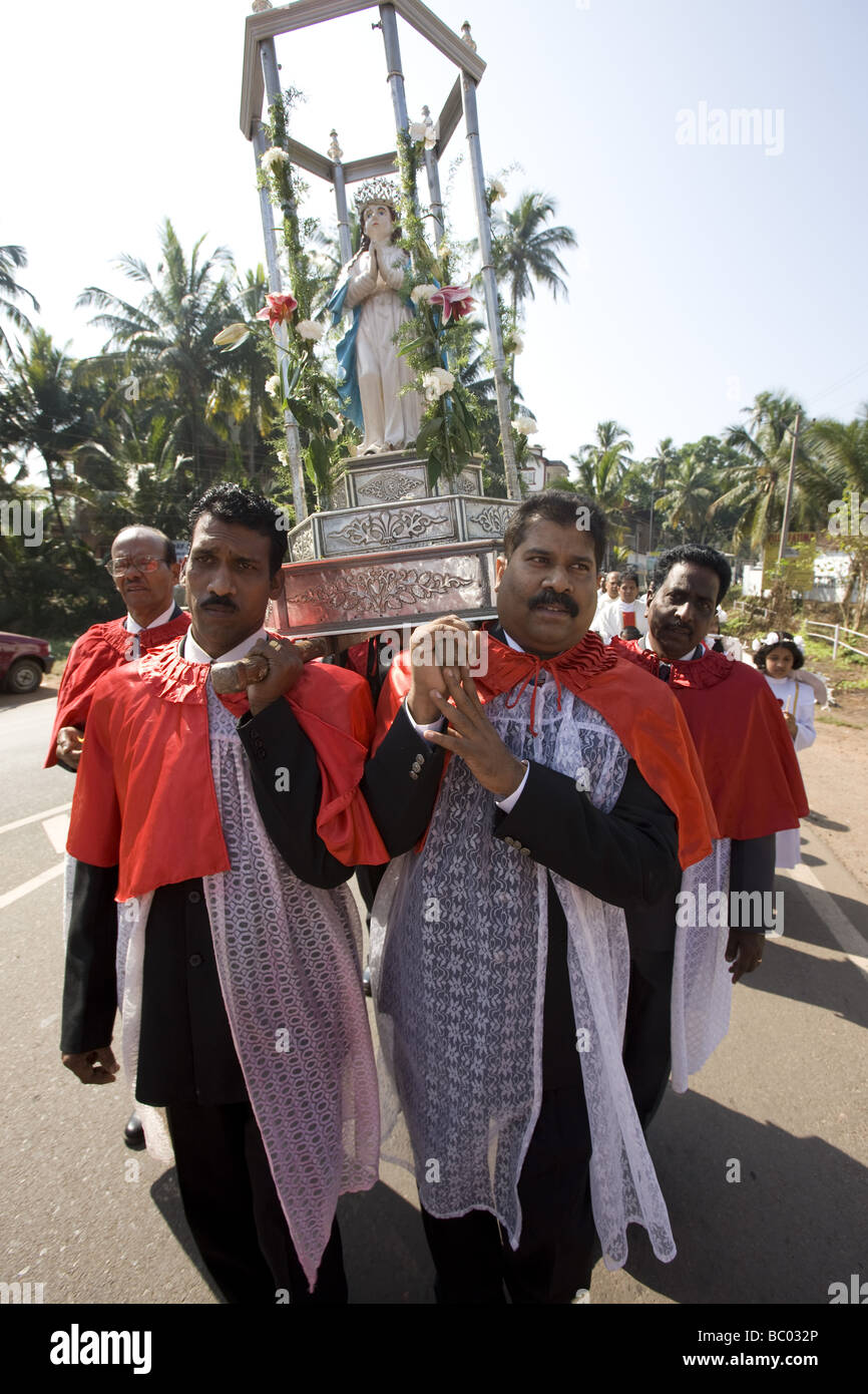 Goan Priest carry Our Lady on silver chariot to St. Alex Church. Goa ...