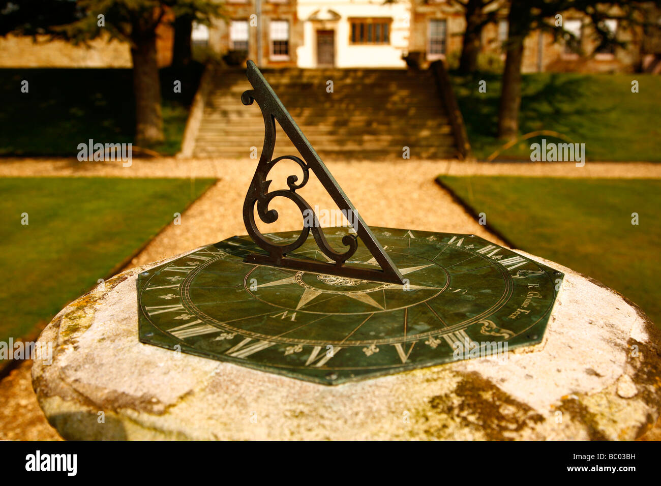 Pedestal,horizontal type sundial,made of brass and mounted on a stone ...
