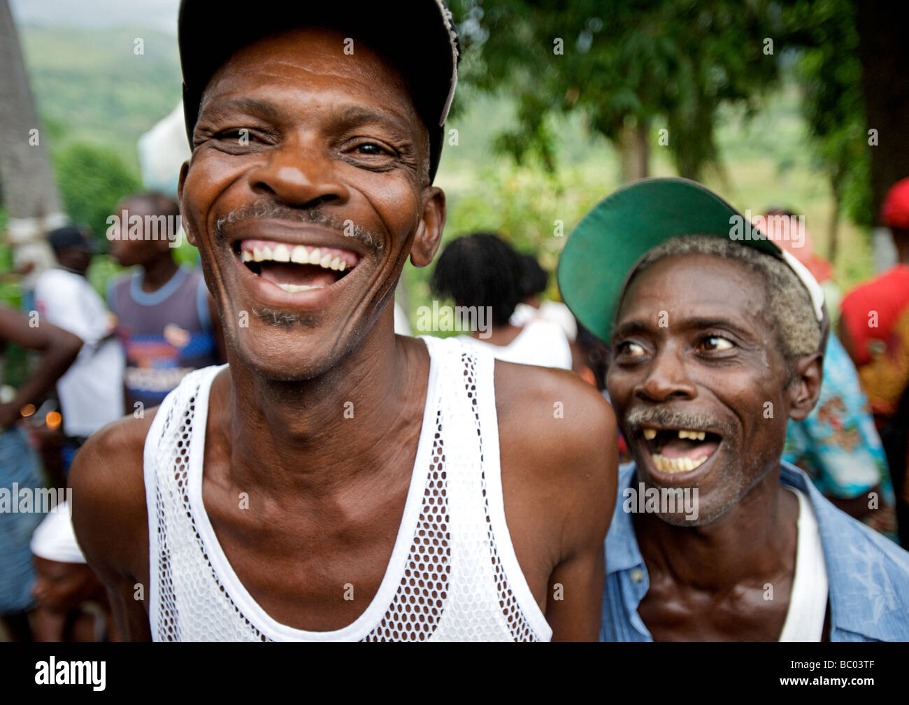 Two pilgrims laugh during the festivities surrounding the Saut D'eau ...