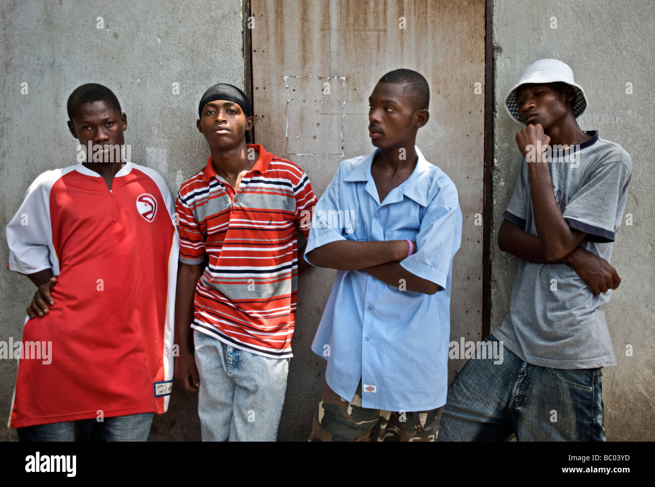 Young rap kreyol artists wait outside a recording studio in Port-au ...