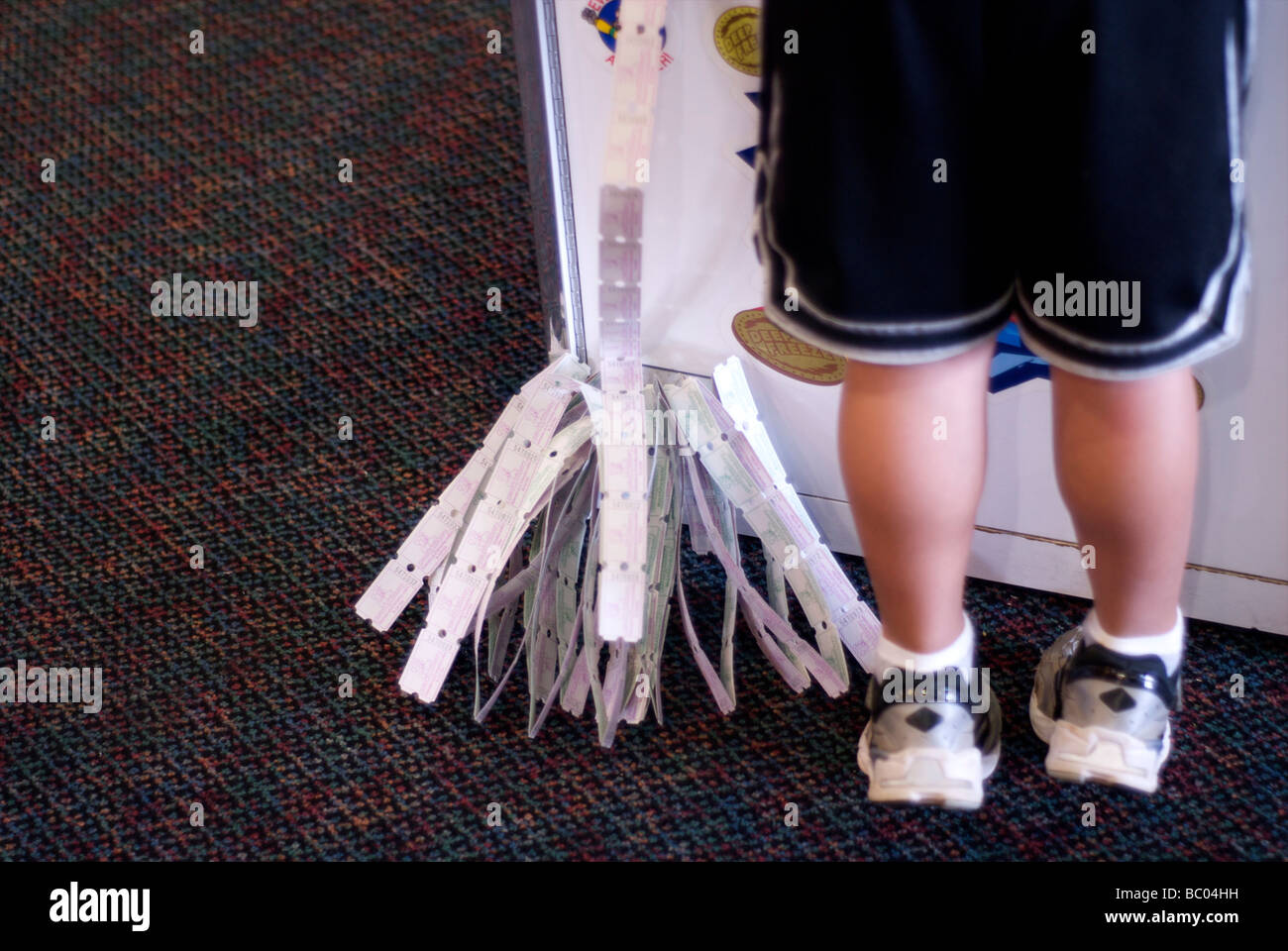Little boy at arcade Stock Photo - Alamy