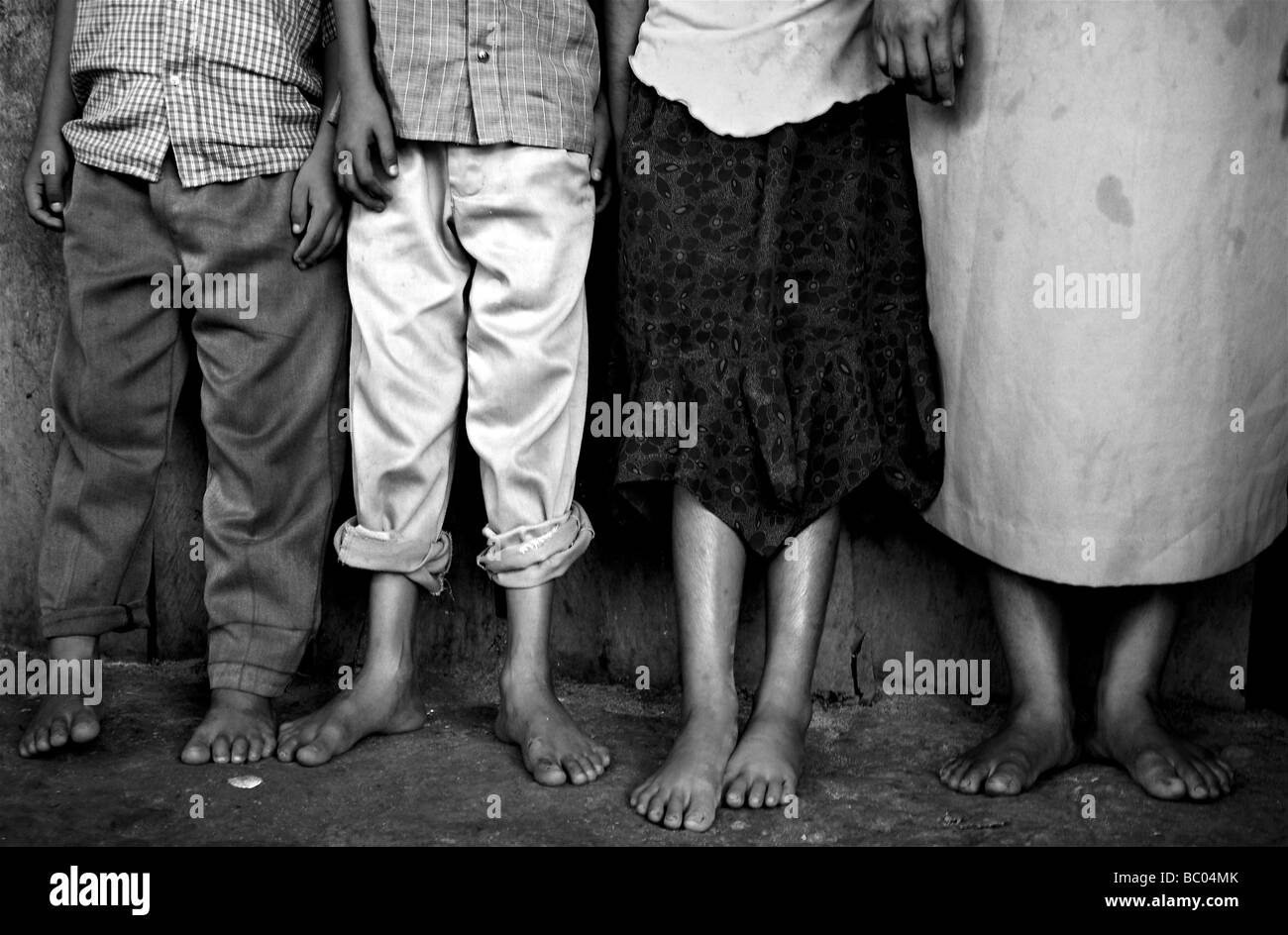 A migrant farming family poses for a portrait outside of their ...
