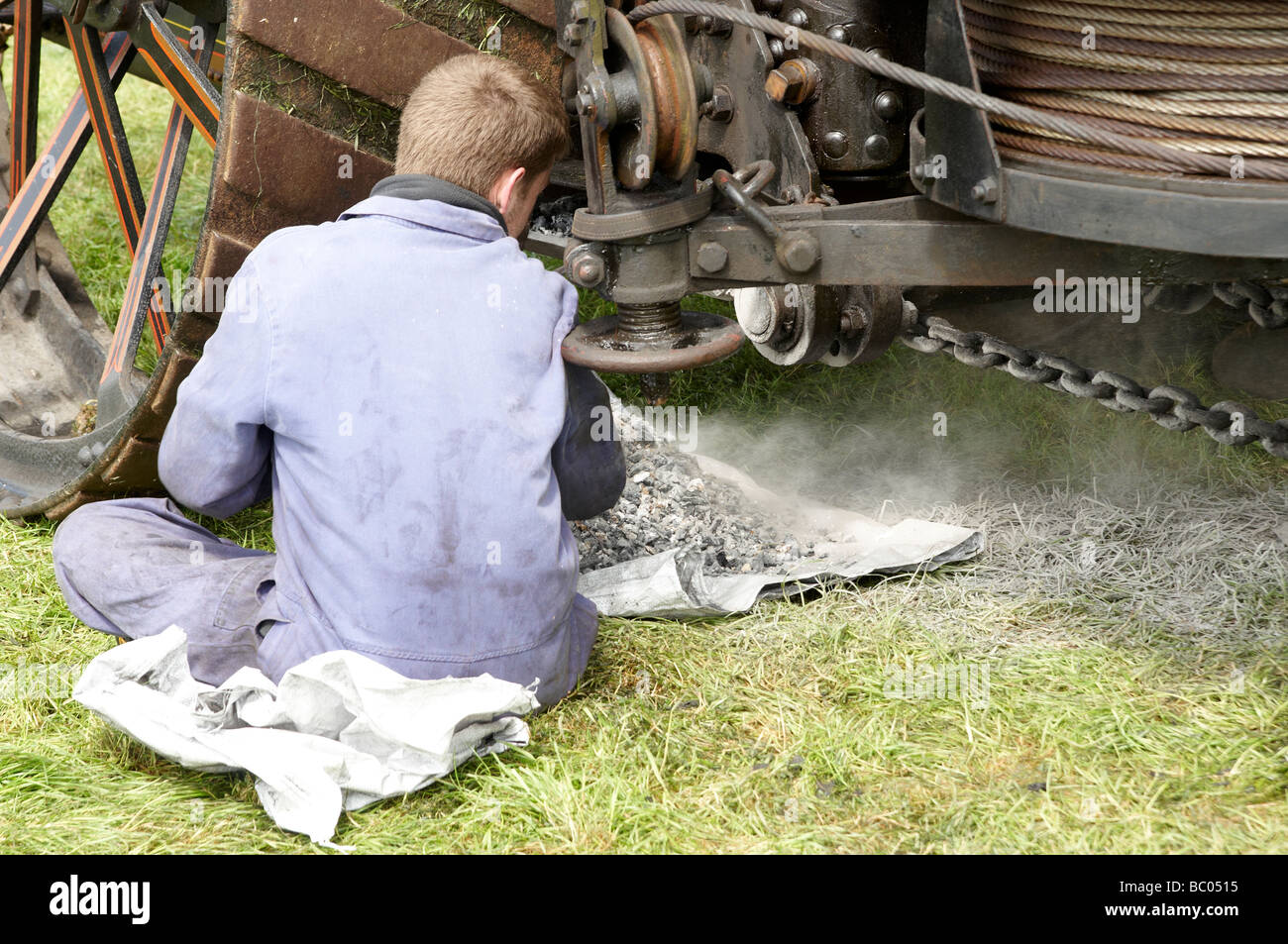 Raking out the ash pan of a steam ploughing engine Stock Photo - Alamy