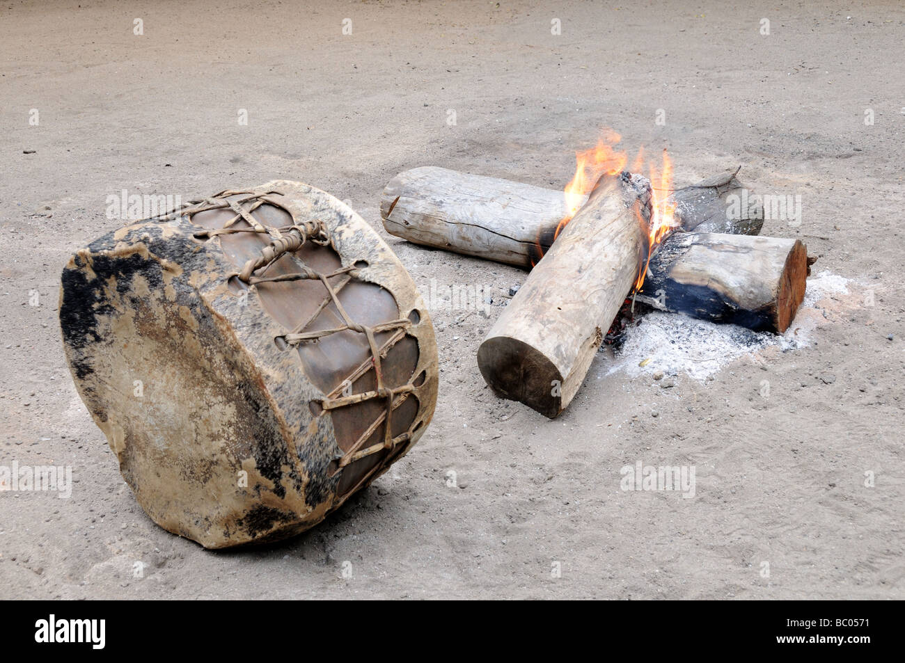 Drum warming by a camp fire ready for a dancing group Mlilwane Wildlife ...
