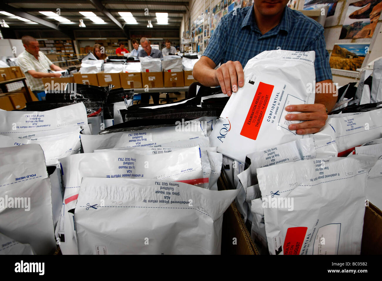 A level exam results are sorted into boxes at the AQA depot in ...