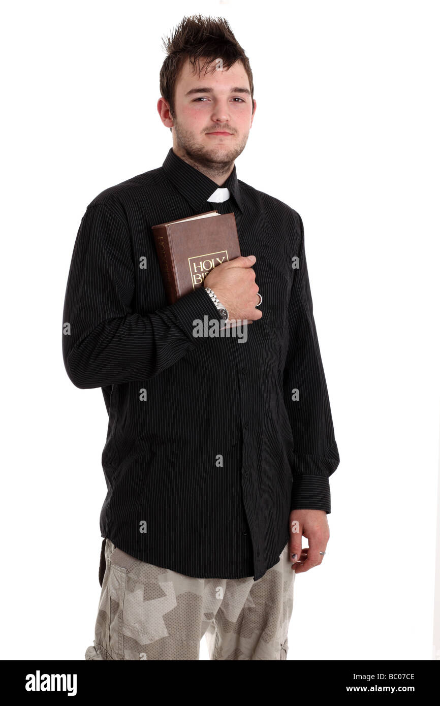 Young pastor holding a bible Stock Photo - Alamy