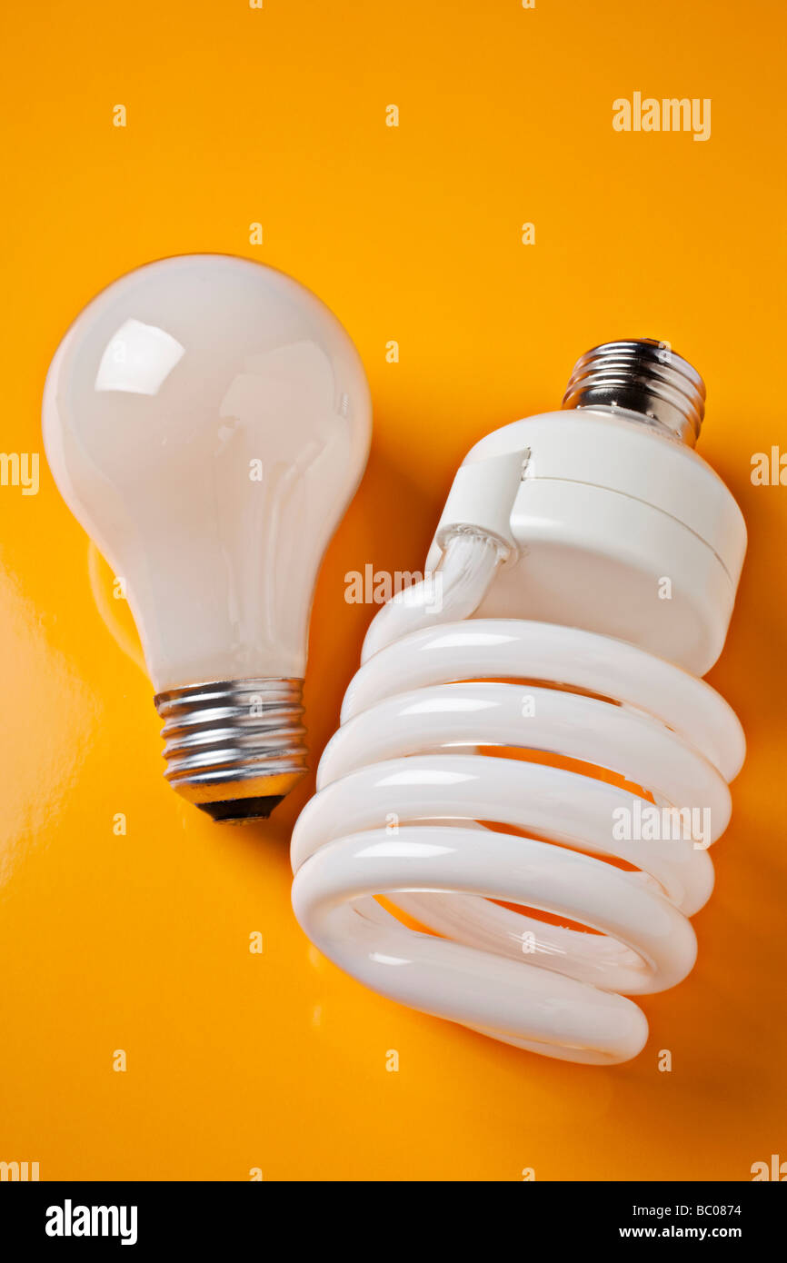 Energy lightbulb and regular light bulb Stock Photo - Alamy