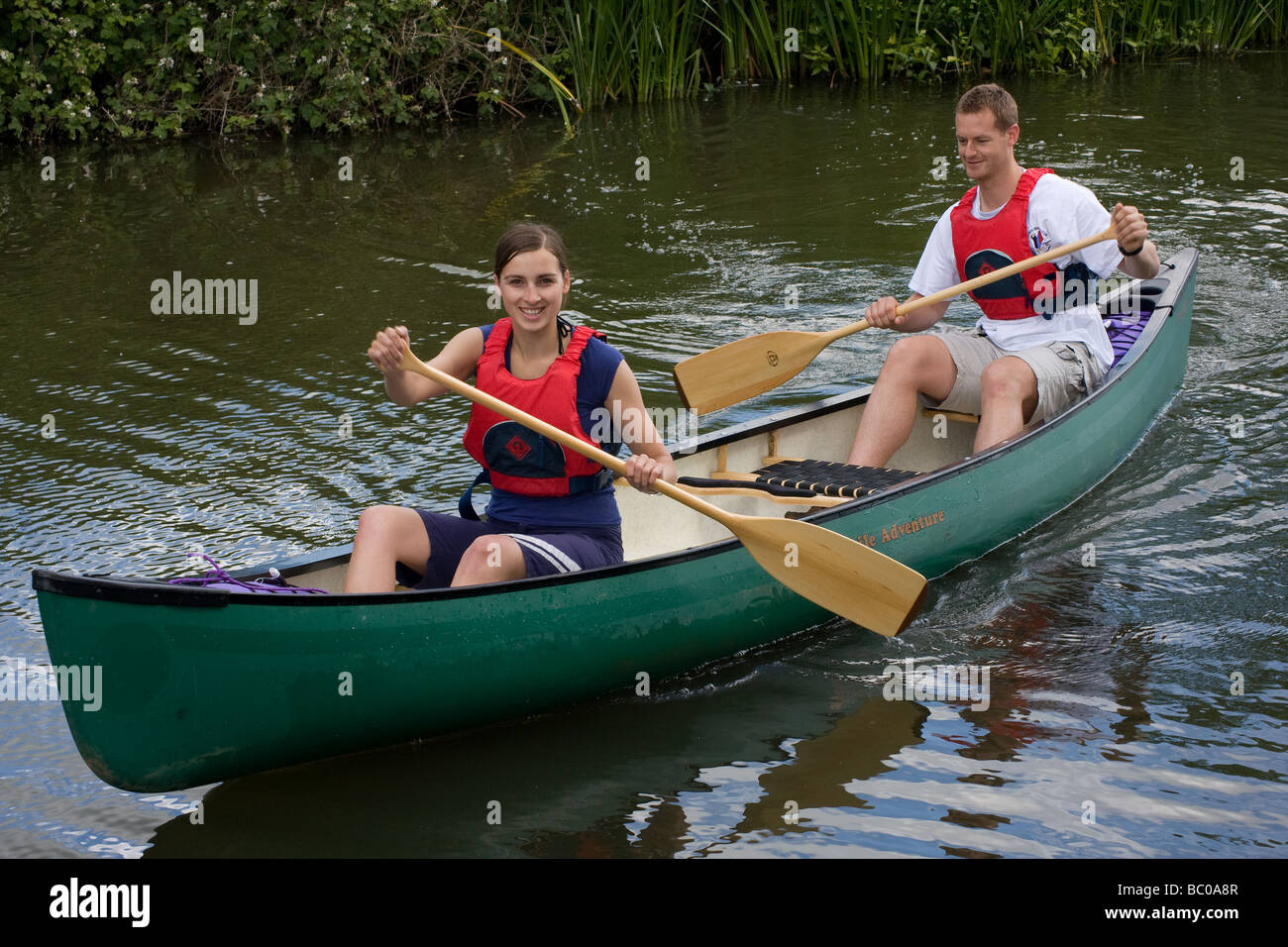 canadian canoeists fish pass canoeing canoe river medway kent england ...