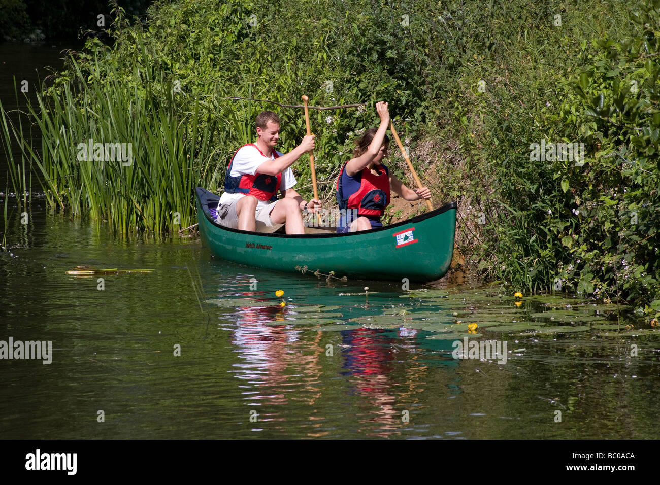 canadian canoeists fish pass canoeing canoe river medway kent england ...