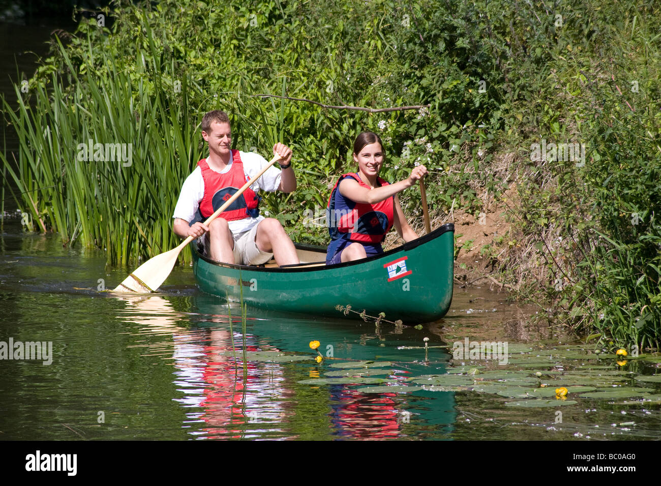 canadian canoeists fish pass canoeing canoe river medway kent england ...