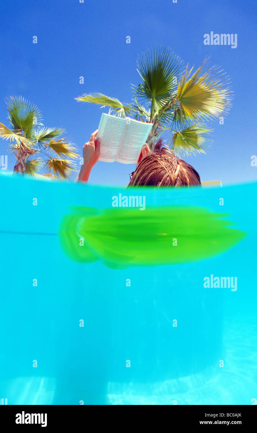 woman 40 floating on inflatable airbed on clear blue water swimming ...