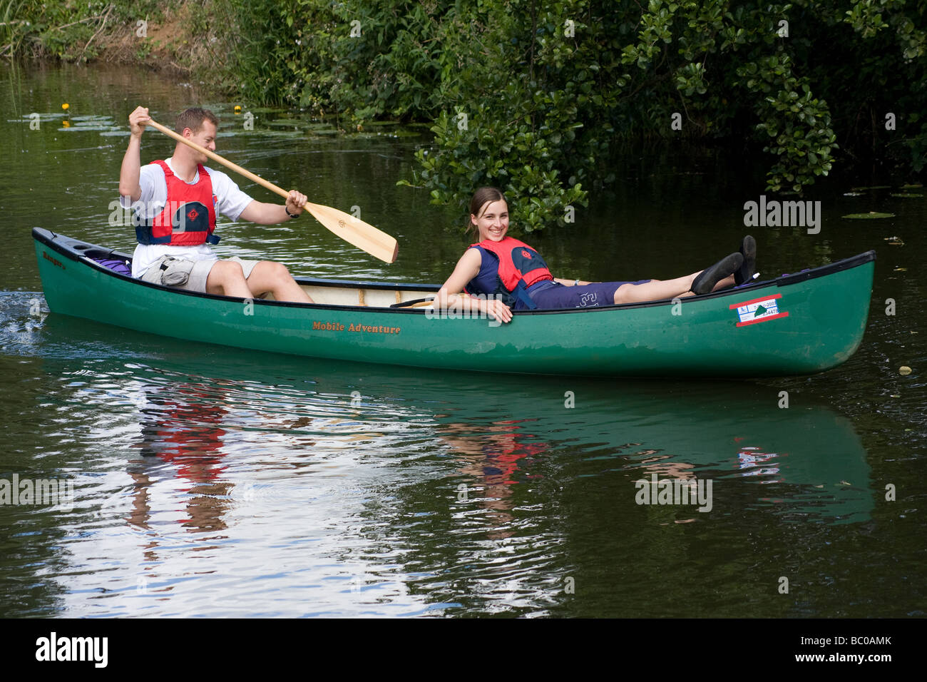 canadian canoeists fish pass canoeing canoe river medway kent england ...