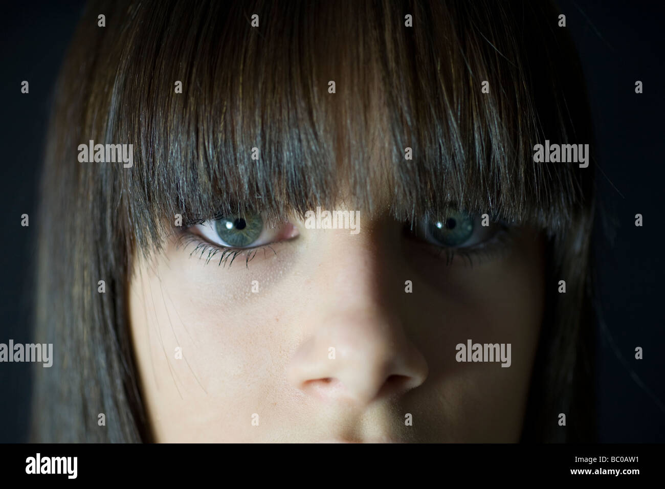 Young teenage girl eyes only staring confident - aged fourteen Stock ...