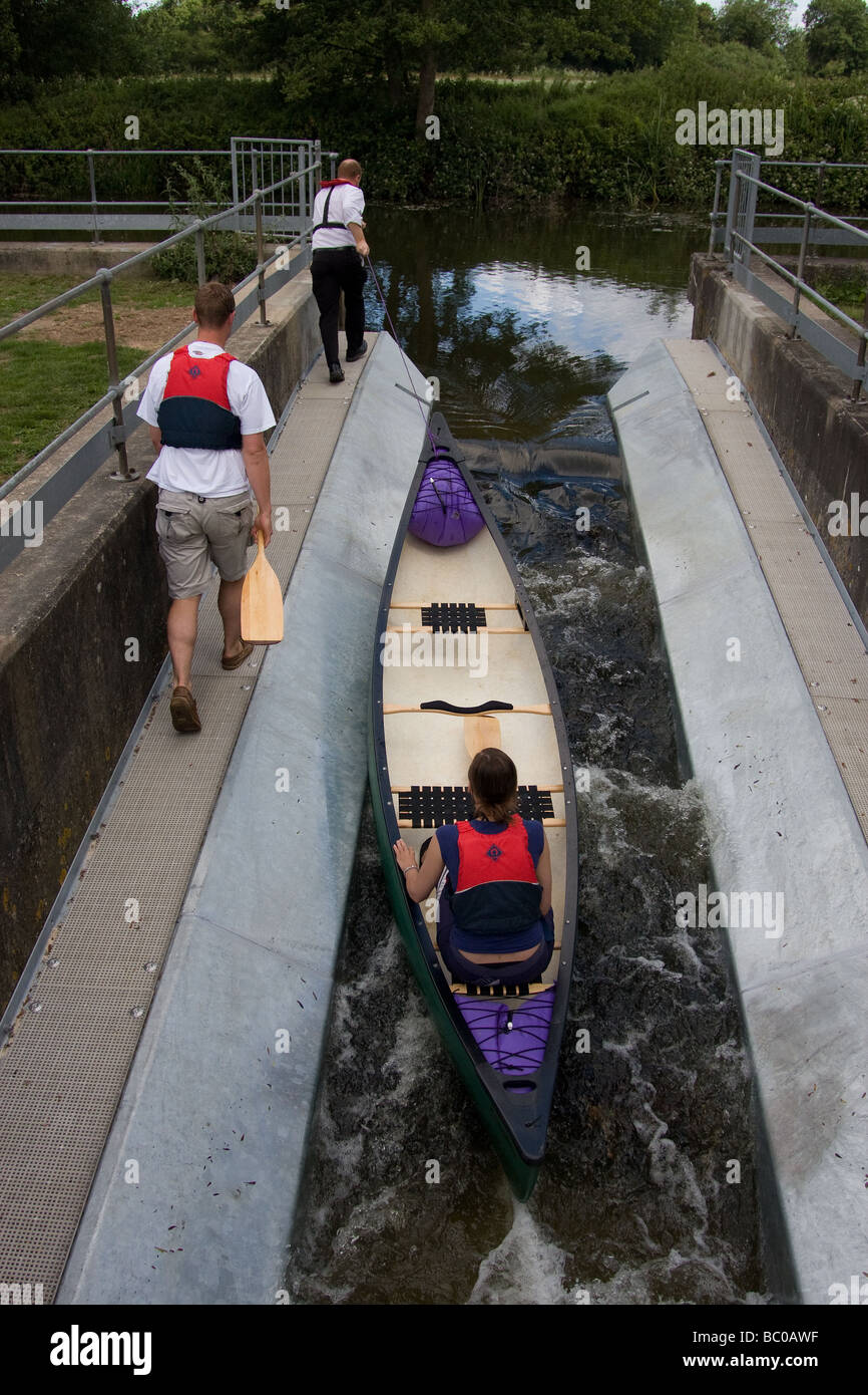 canadian canoeists fish pass canoeing canoe river medway kent england ...